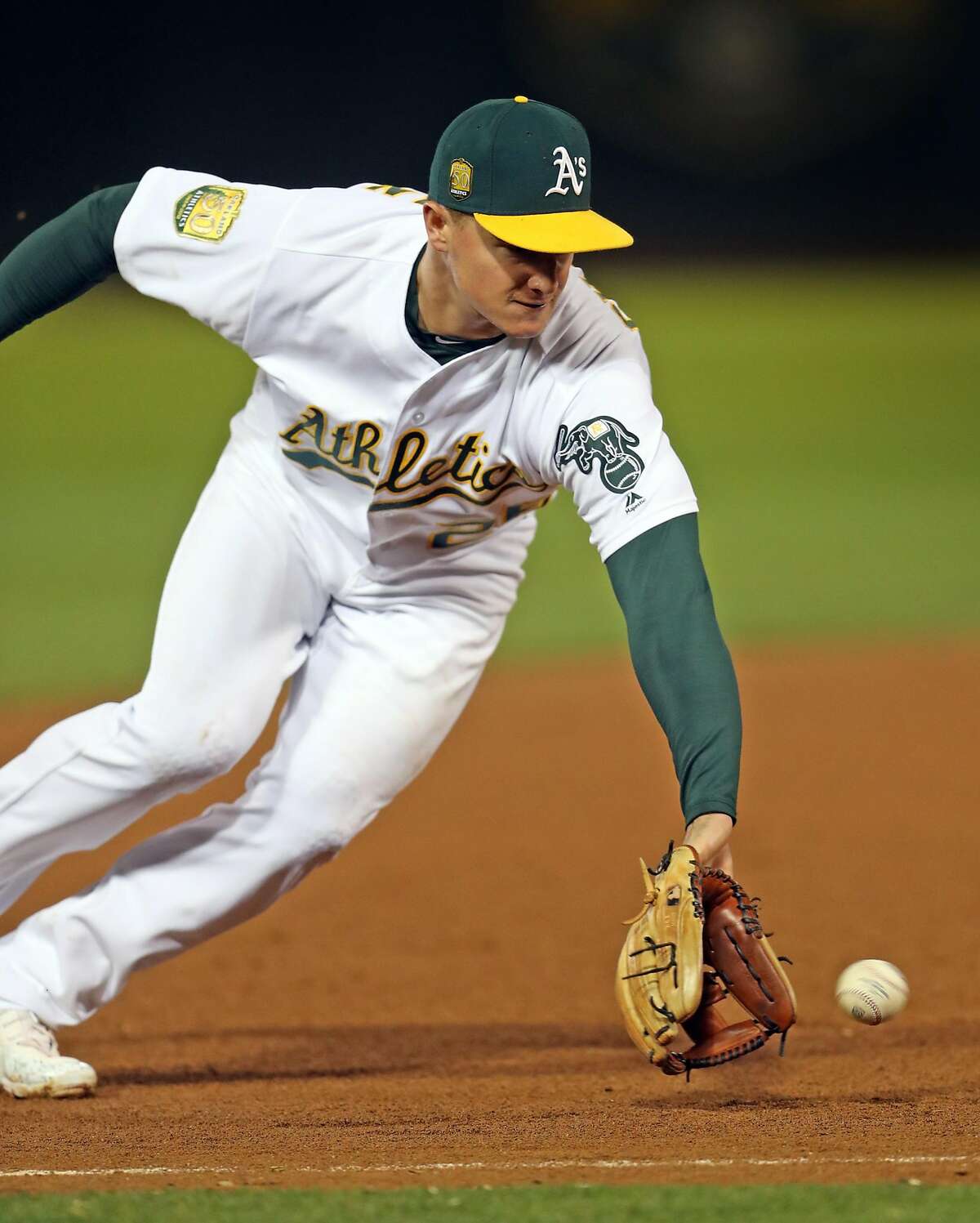 A’s Matt Chapman swings away, close to playing defense