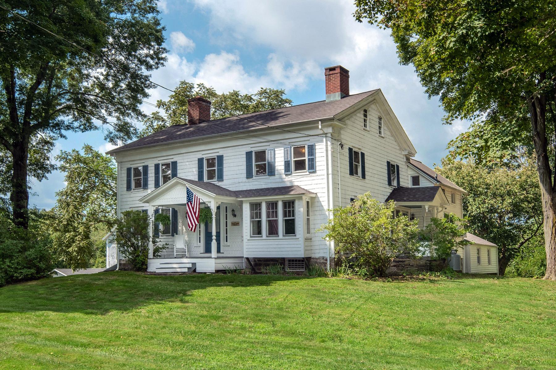 New England farmhouse a classic, outhouse and all