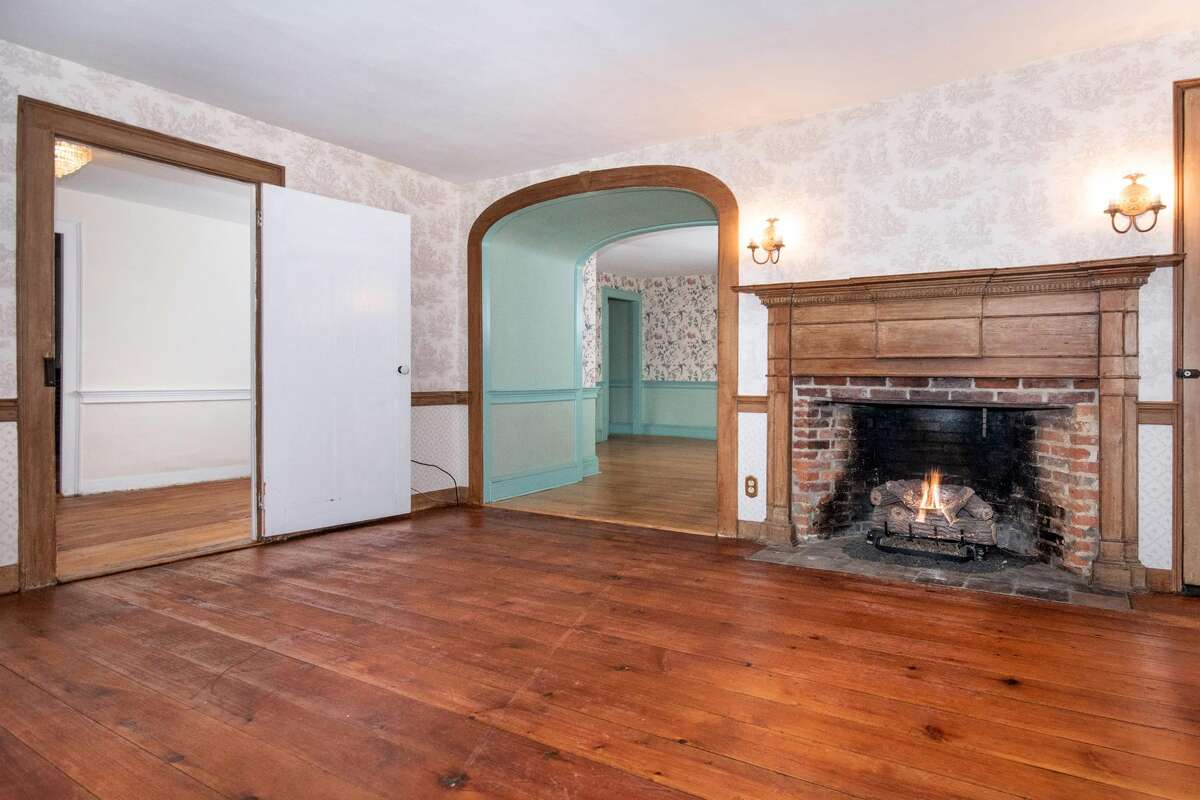 New England farmhouse a classic, outhouse and all