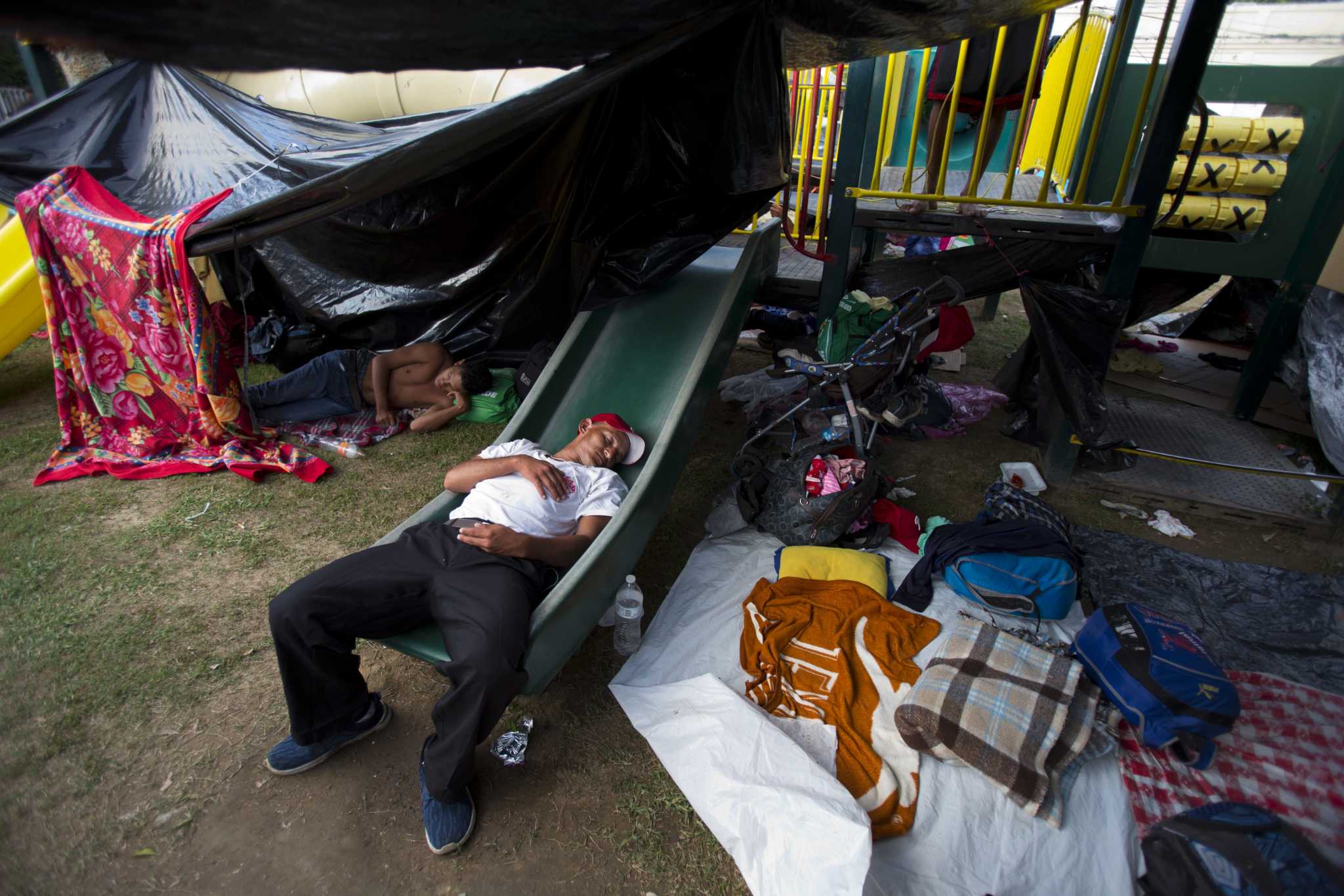 Trudging along, migrants seek a better life