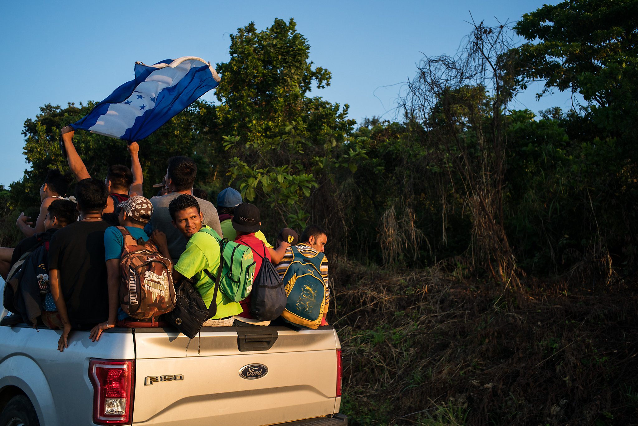 Trudging along, migrants seek a better life