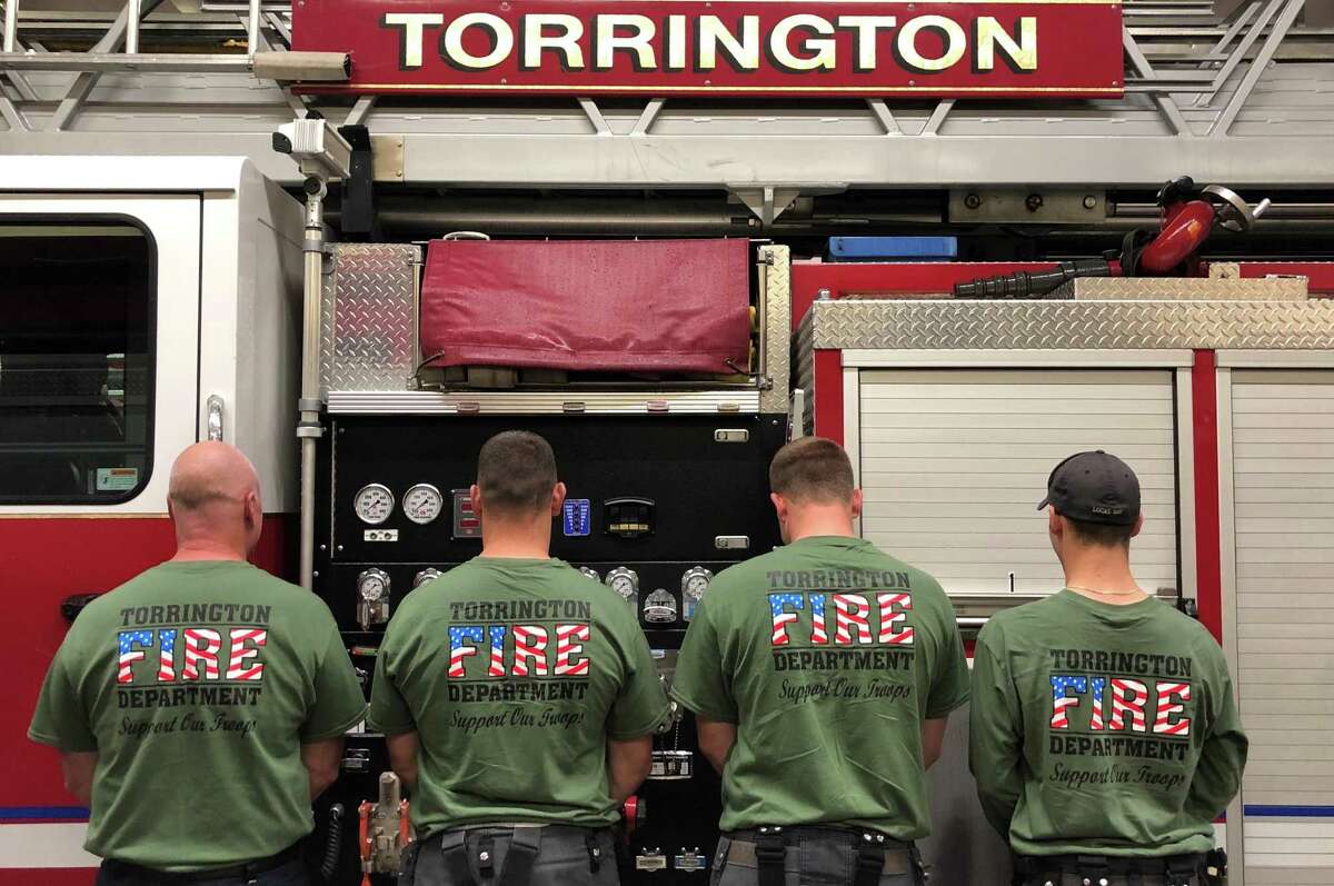 Torrington firefighters’ T-shirts signal support