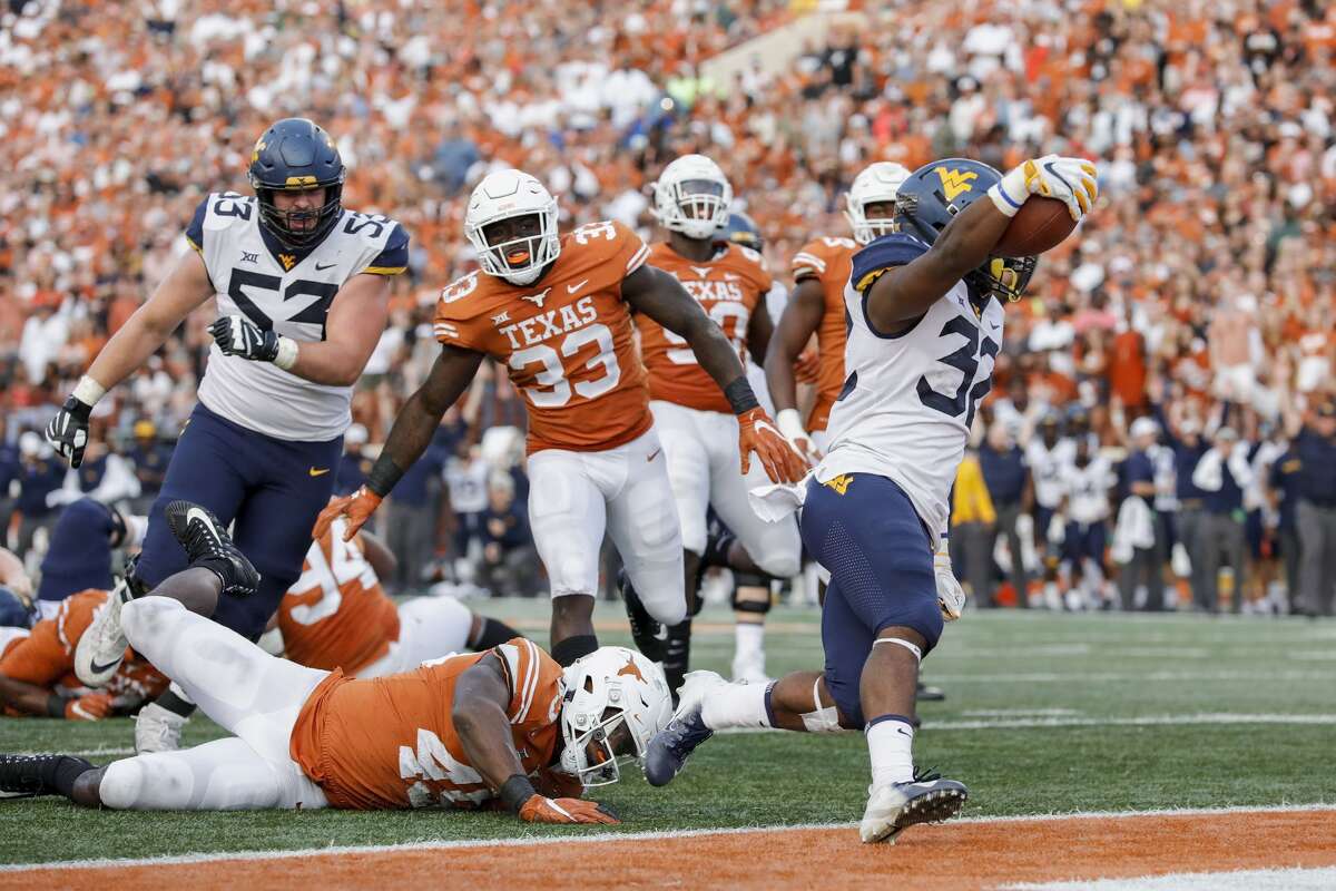 In defense-optional affair, No. 17 Texas falls to No. 13 West Virginia
