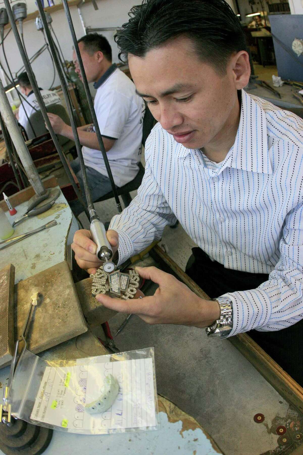 This is what it’s like waiting to meet Johnny Dang, Houston’s King of Bling