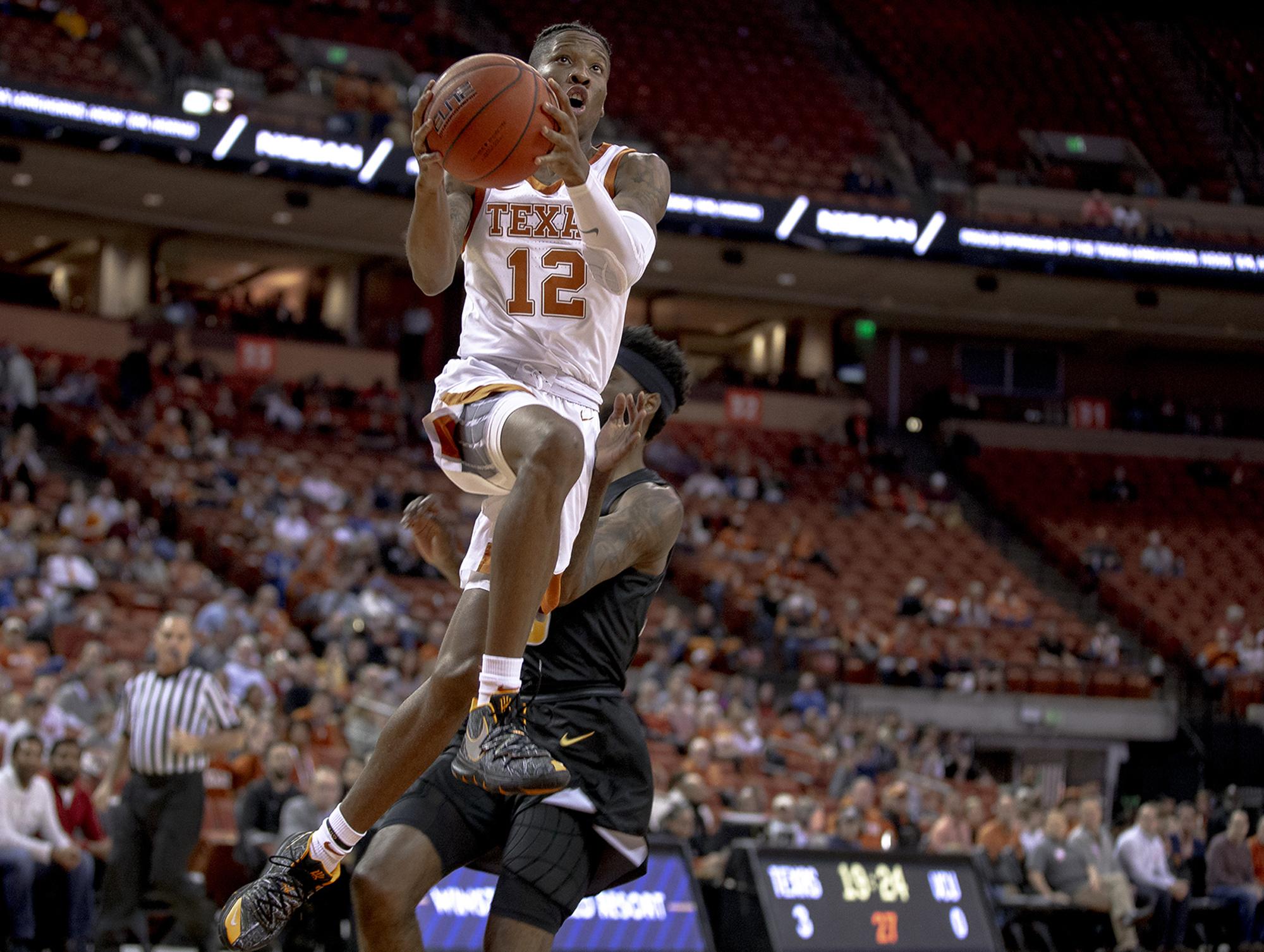 Roach gets back to basics, helps Texas overcome Purdue