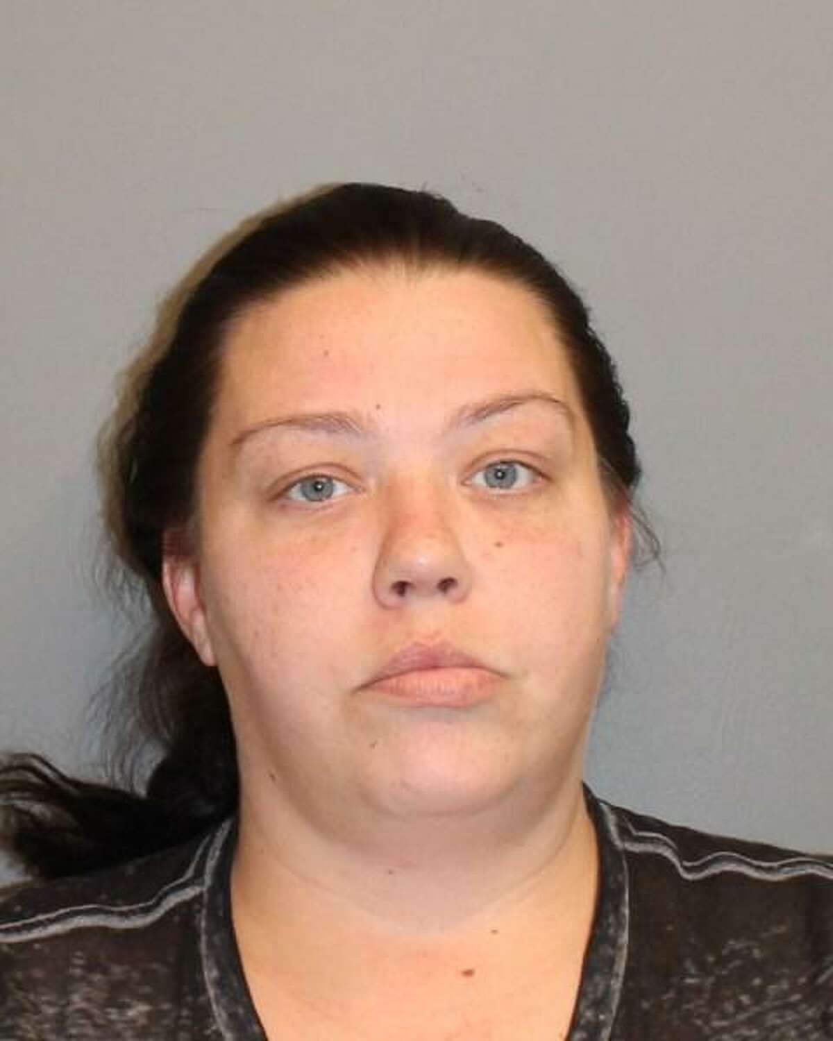 Norwalk woman charged with assaulting two children