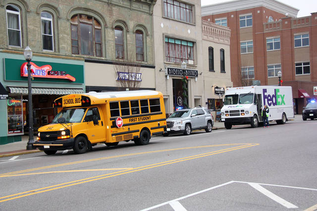 PHOTO — FedEx truck, school bus involved in minor Main Street incident