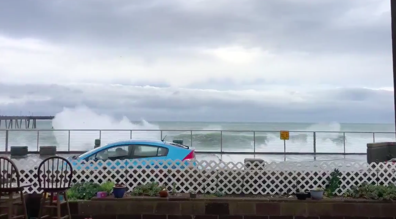 High tides cause rough waves to break over seawall in Pacifica